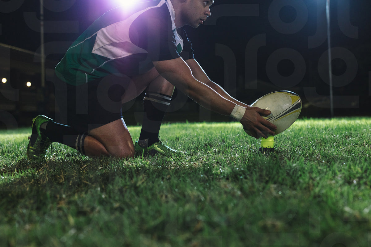 Rugby player placing the ball on tee for penalty – Jacob Lund ...