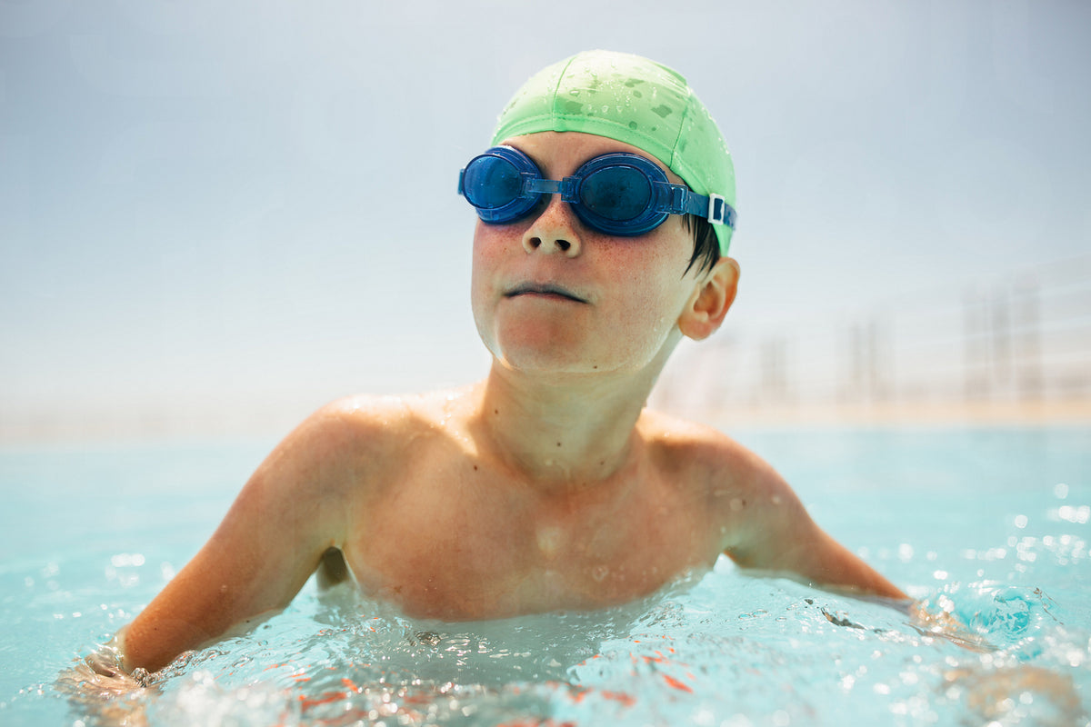 Boy learning to swim – Jacob Lund Photography Store- premium stock photo