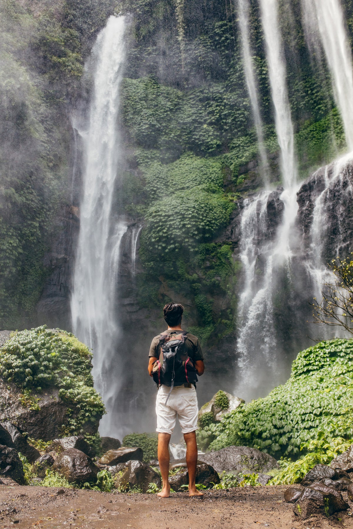 Young male hiker looking at waterfall – Jacob Lund Photography Store ...