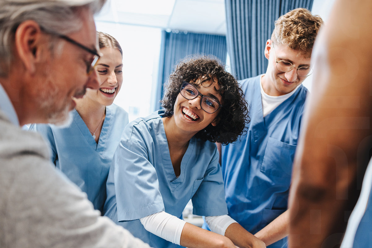 Health students receiving medical training from a senior doctor in a t ...