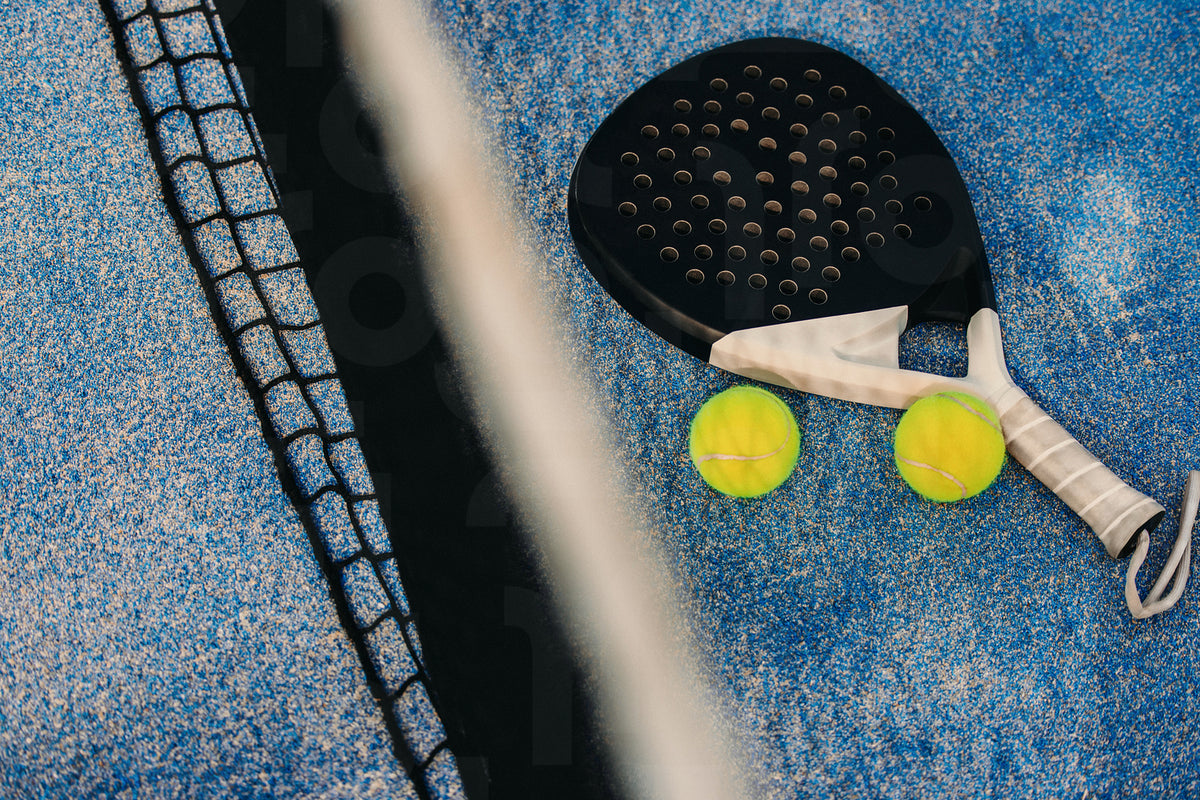 Overhead view of padel racket and padel balls on blue court – Jacob ...