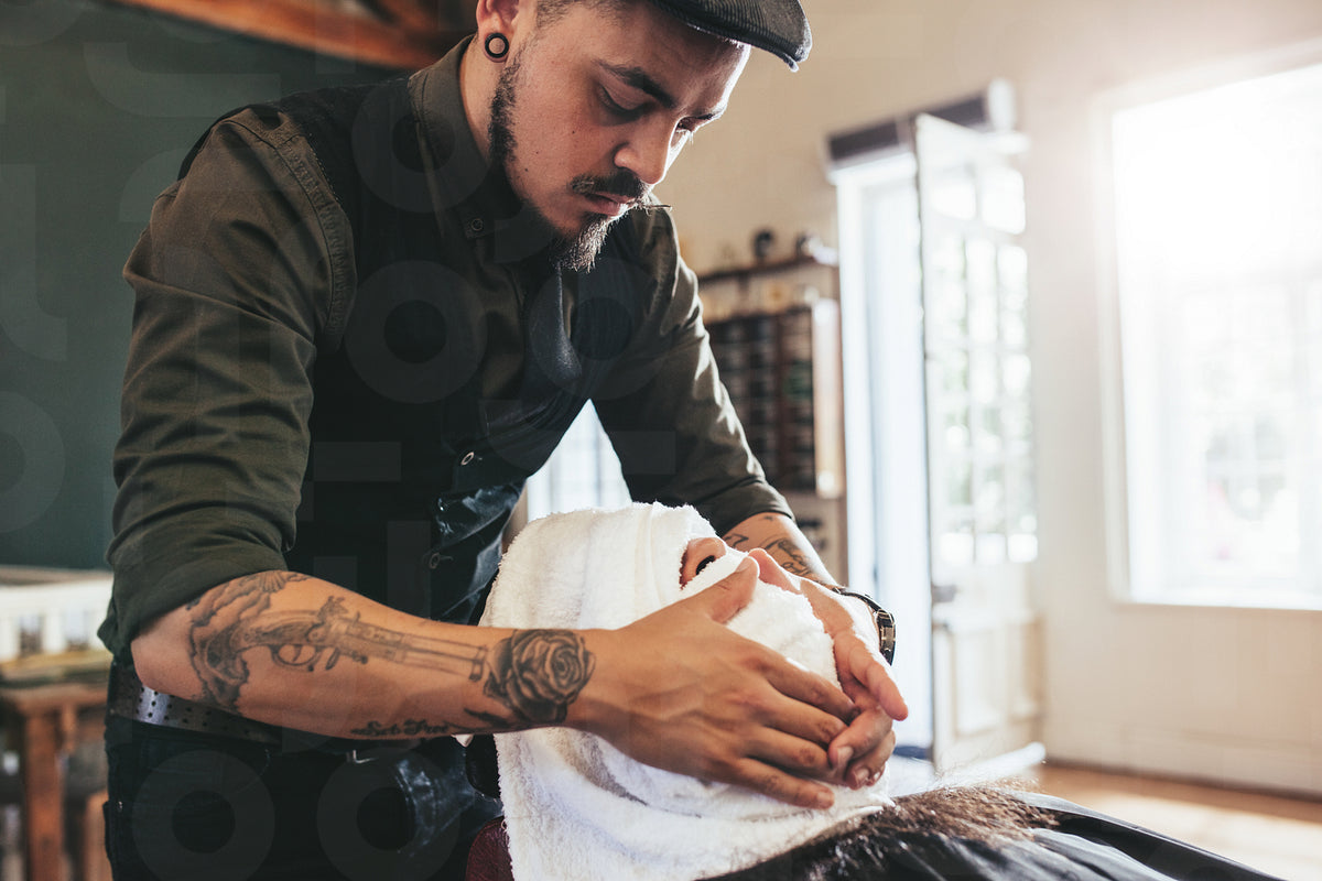 Barber applies a warm cloth on face – Jacob Lund Photography Store ...