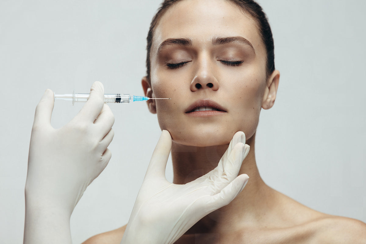 Woman gets beauty facial injections – Jacob Lund Photography Store ...