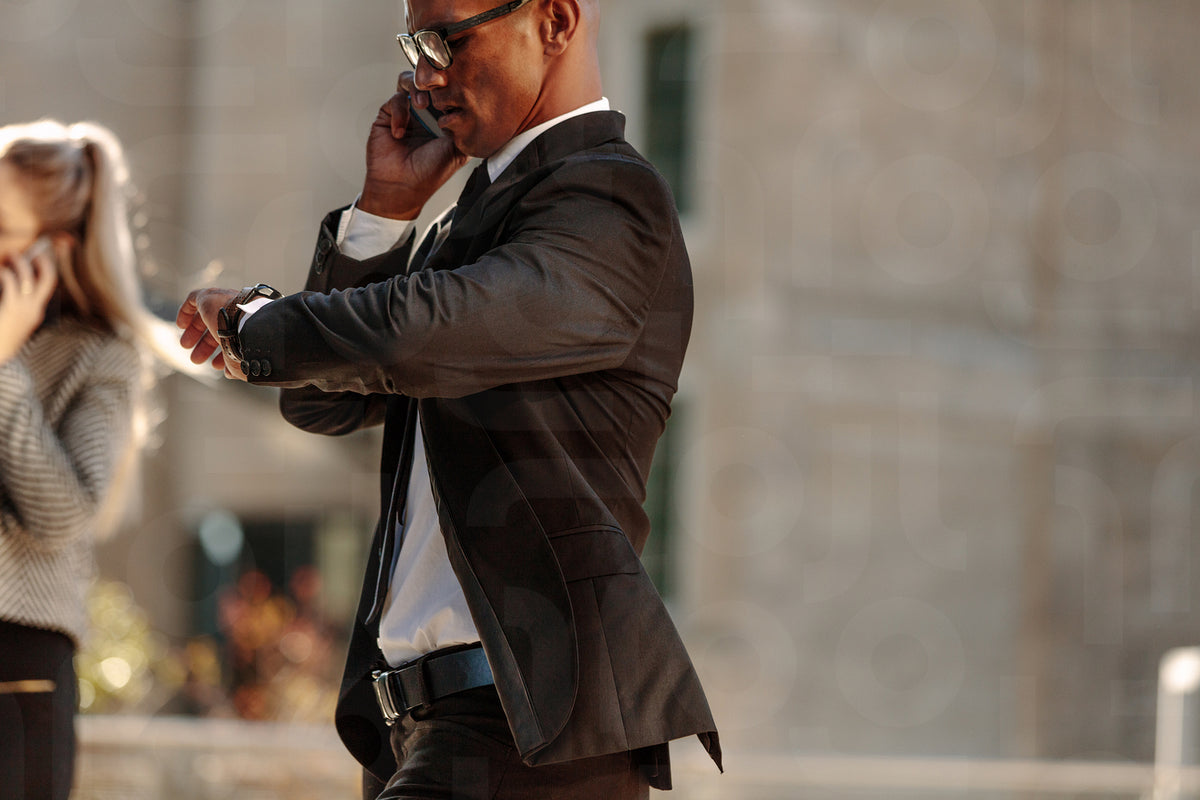 Businessman checking time while going to office – Jacob Lund ...