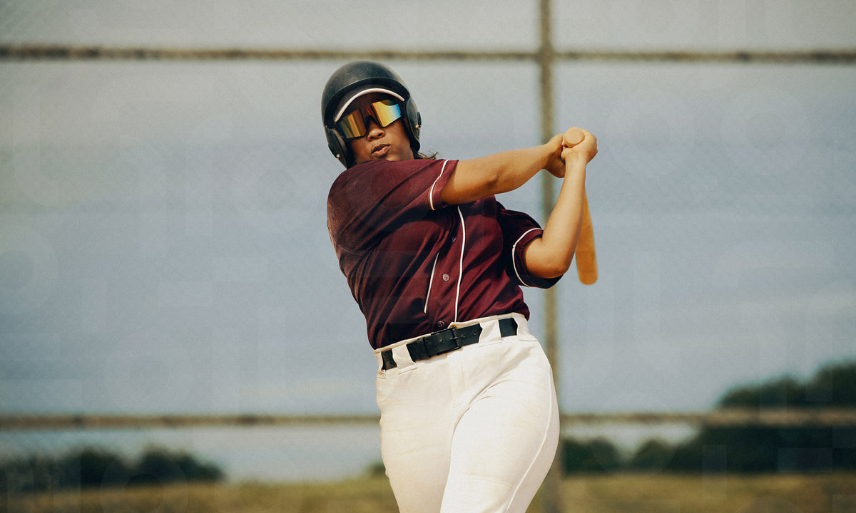 Young baseball player swinging bat and wearing maroon jersey – Jacob ...
