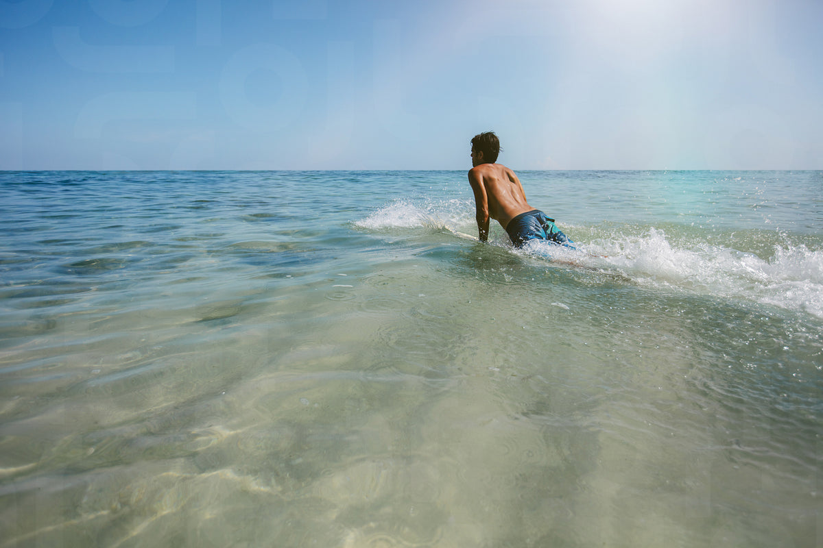 Young man enjoying a surf in sea water – Jacob Lund Photography Store ...