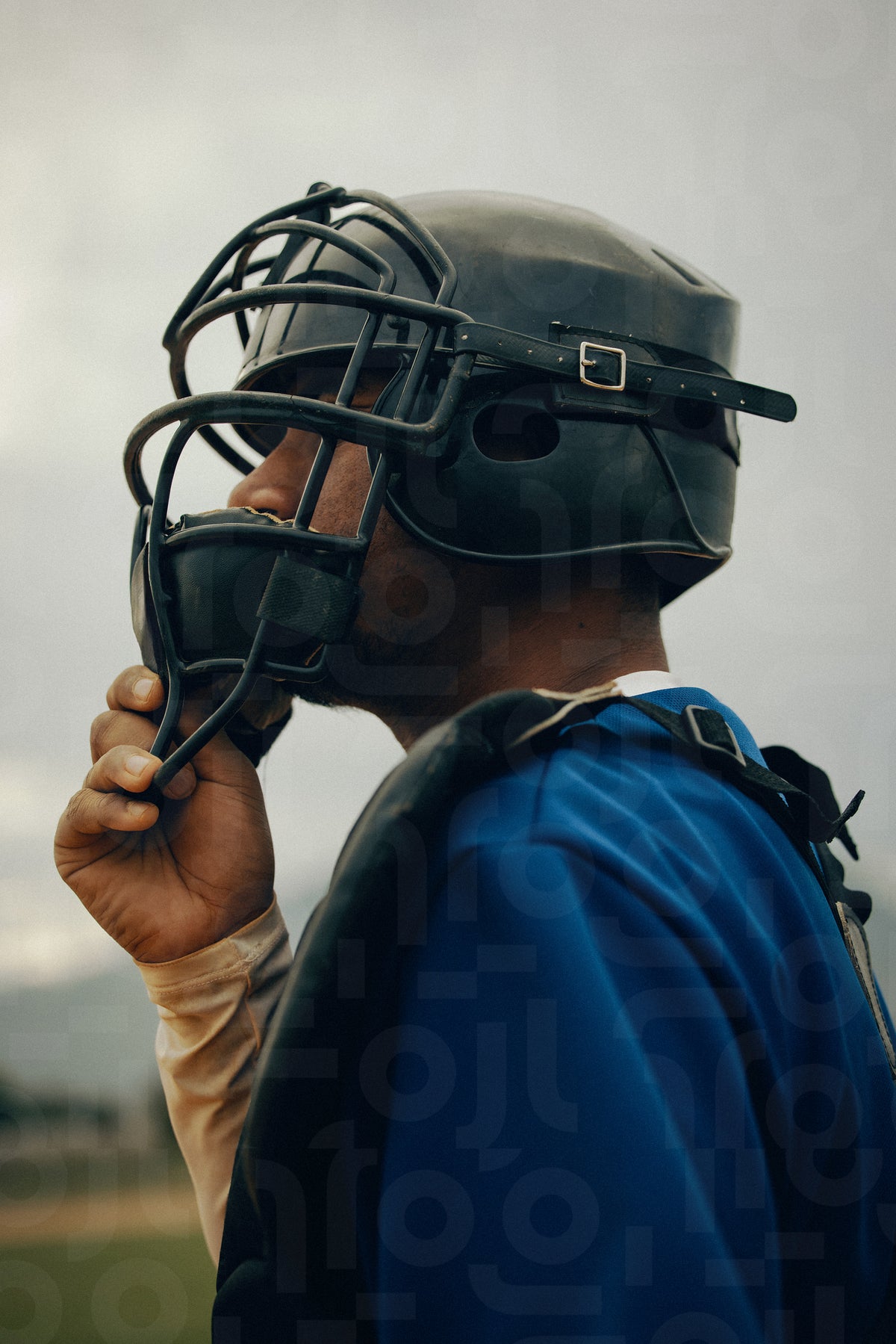 Baseball player wearing helmet with visor and chest protector on the f ...