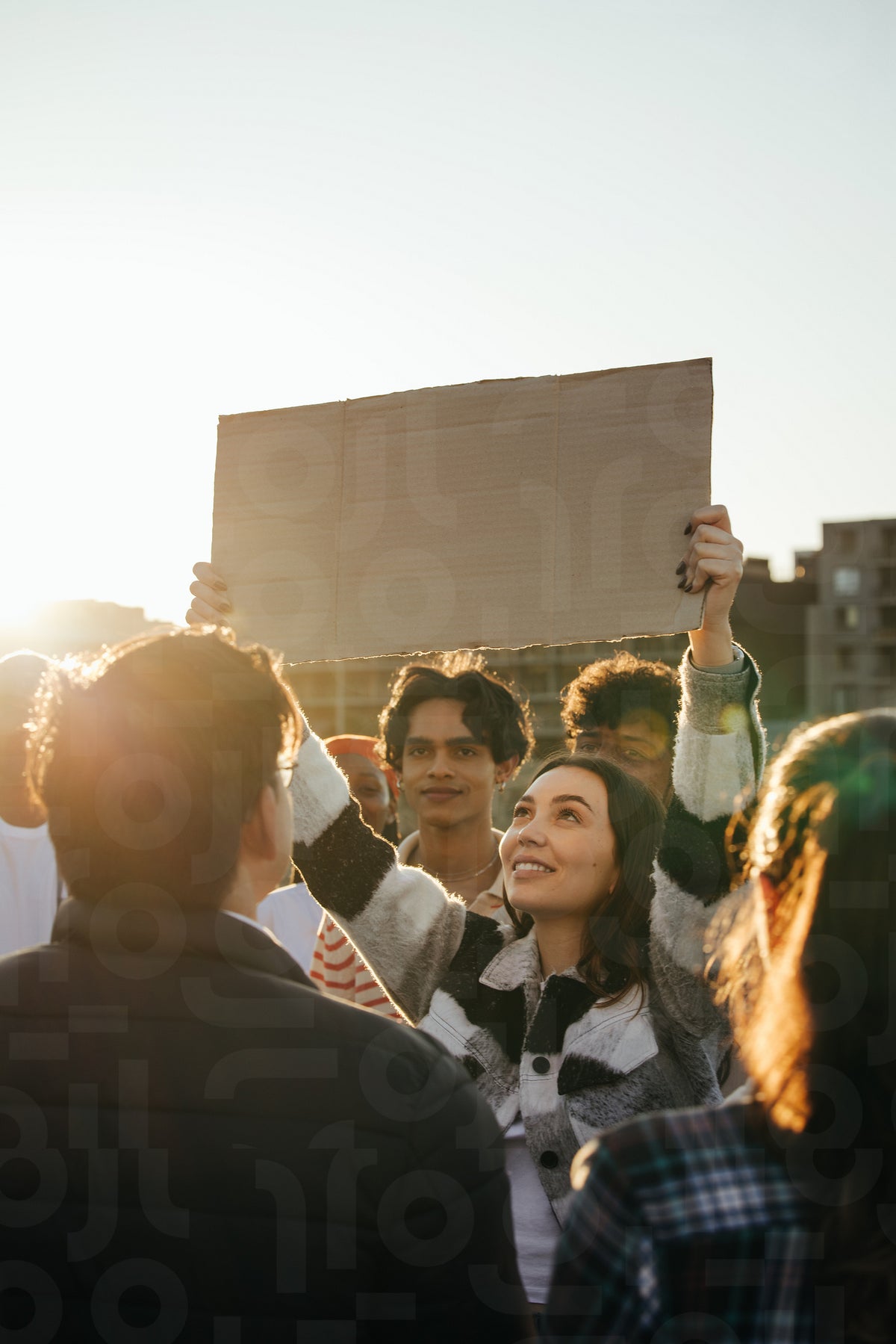 Young adults holding a sign during a peaceful outdoor protest – Jacob ...