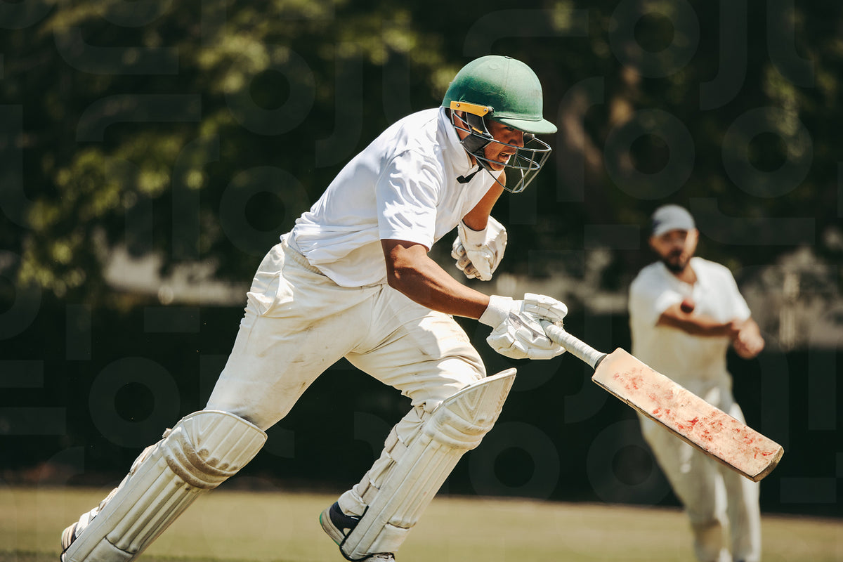 Cricket batsman running between the wickets during a match – Jacob Lund ...