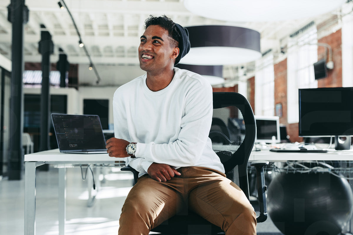 Happy software developer smiling in a modern office – Jacob Lund ...