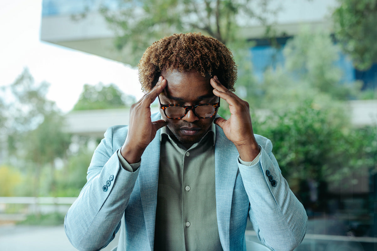 Worried professional businessman feeling stressed in a modern office ...