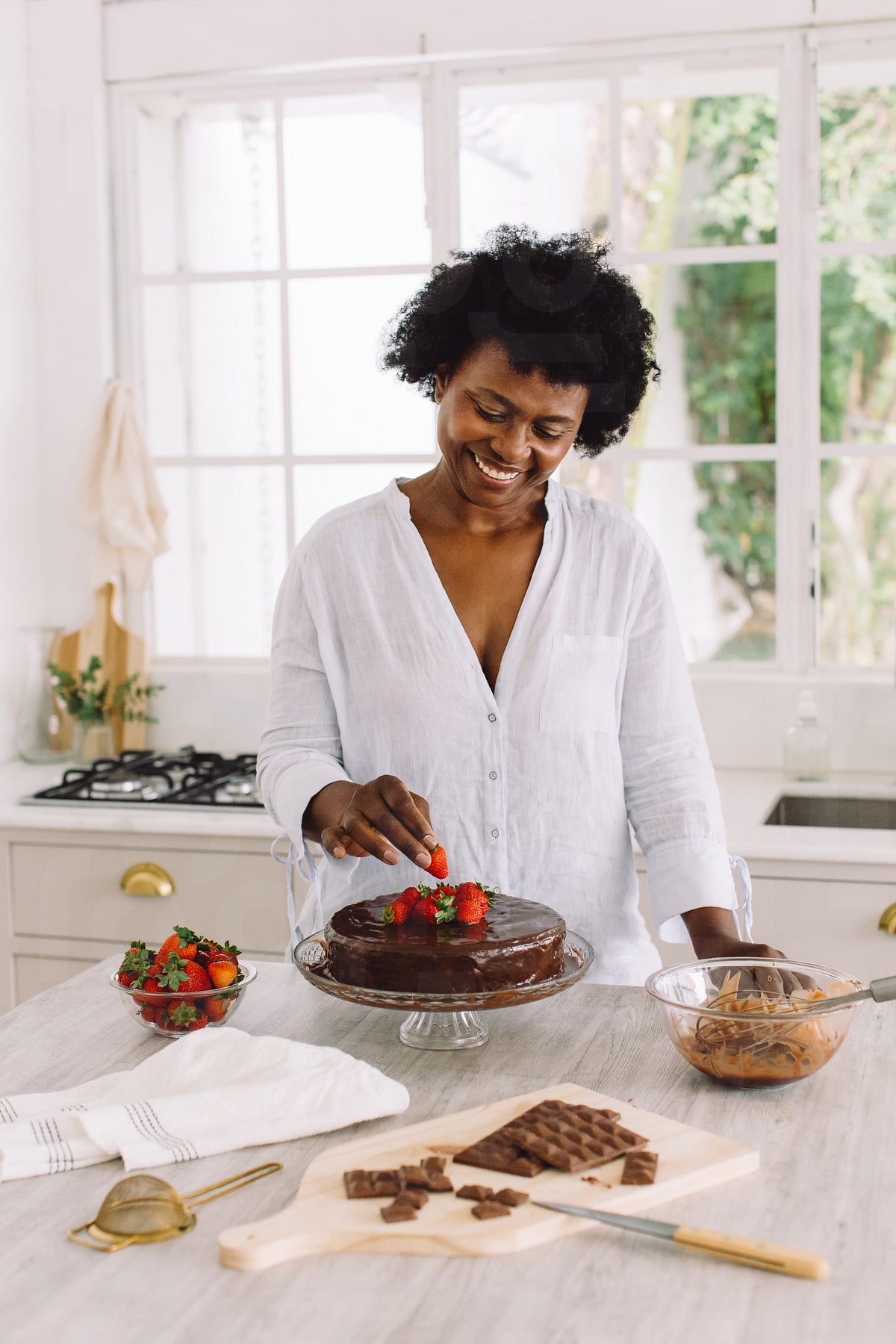 Mature woman preparing cake at home kitchen – Jacob Lund Photography ...