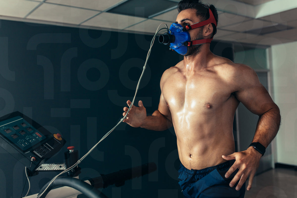 Fit and muscular athlete with mask running on treadmill – Jacob Lund ...