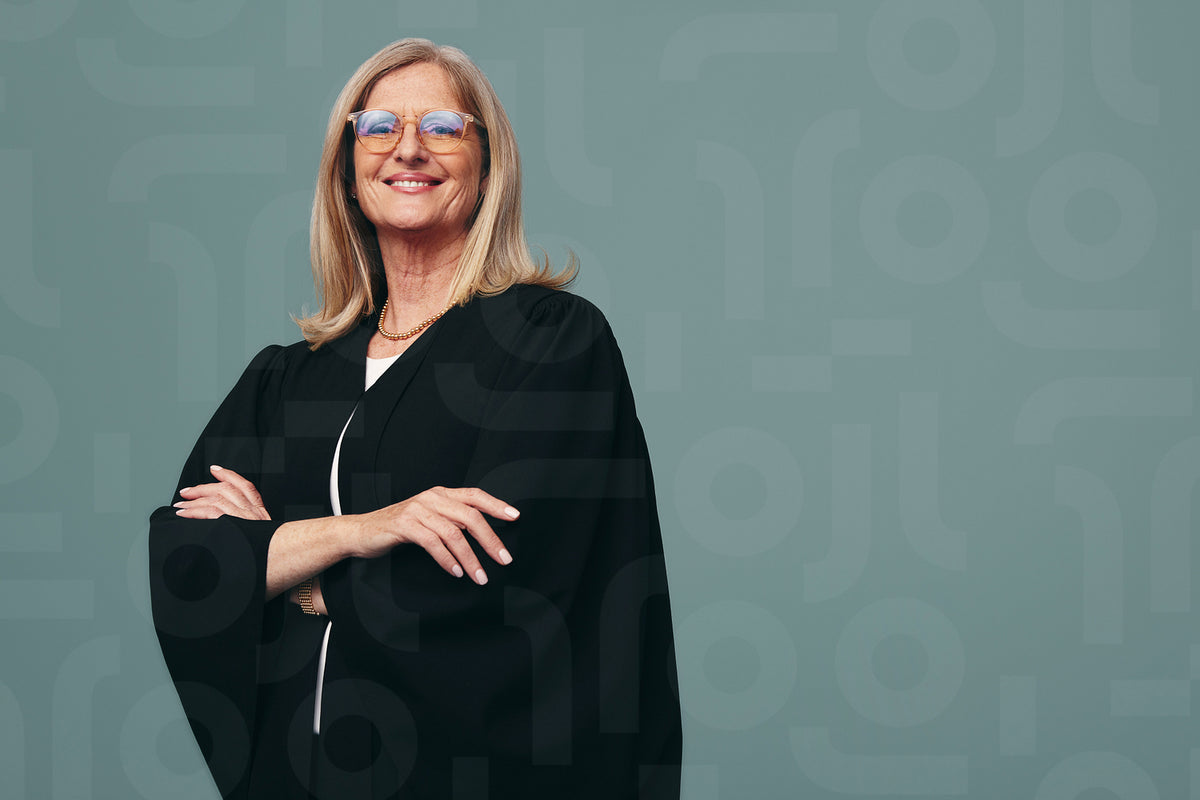 Happy female judge smiling at the camera in a studio – Jacob Lund ...