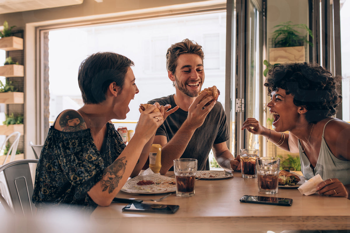 Friends chilling out at a restaurant – Jacob Lund Photography Store ...