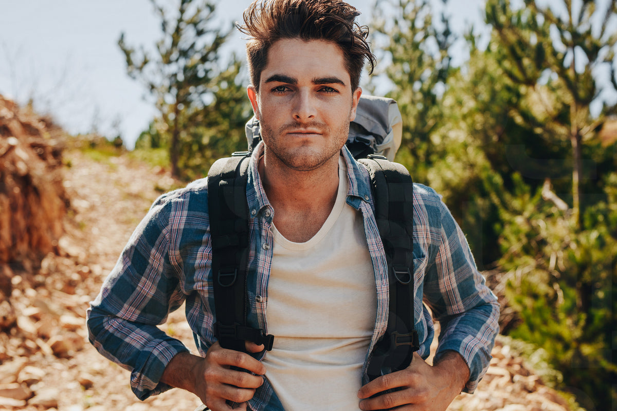 Young guy with backpack on mountain trail – Jacob Lund Photography ...