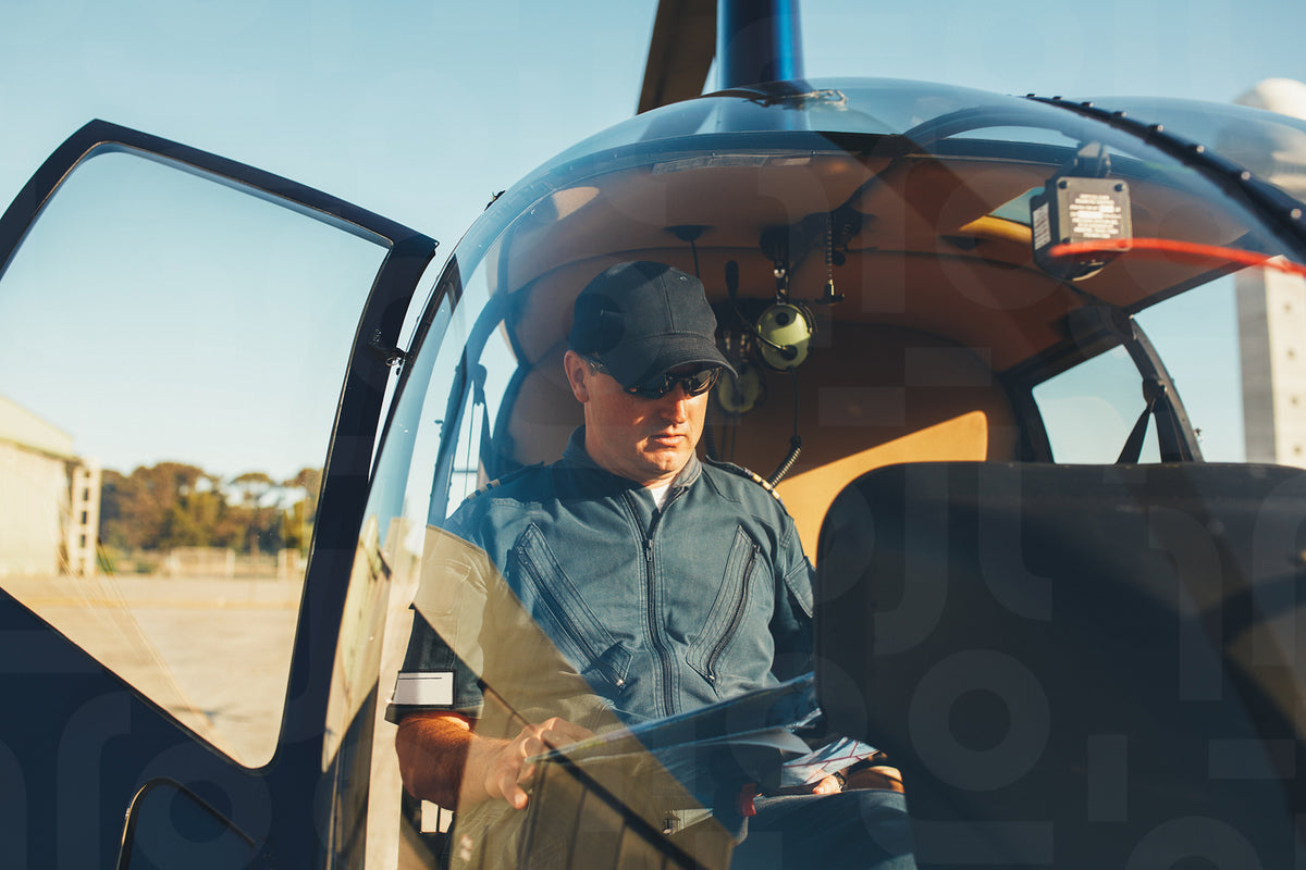 Pilot reading map in a helicopter cockpit – Jacob Lund Photography ...