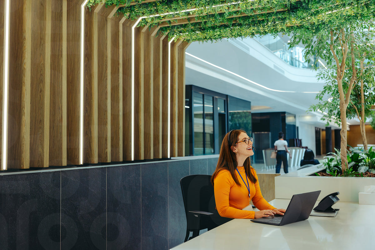 Friendly receptionist working in a modern office environment – Jacob ...