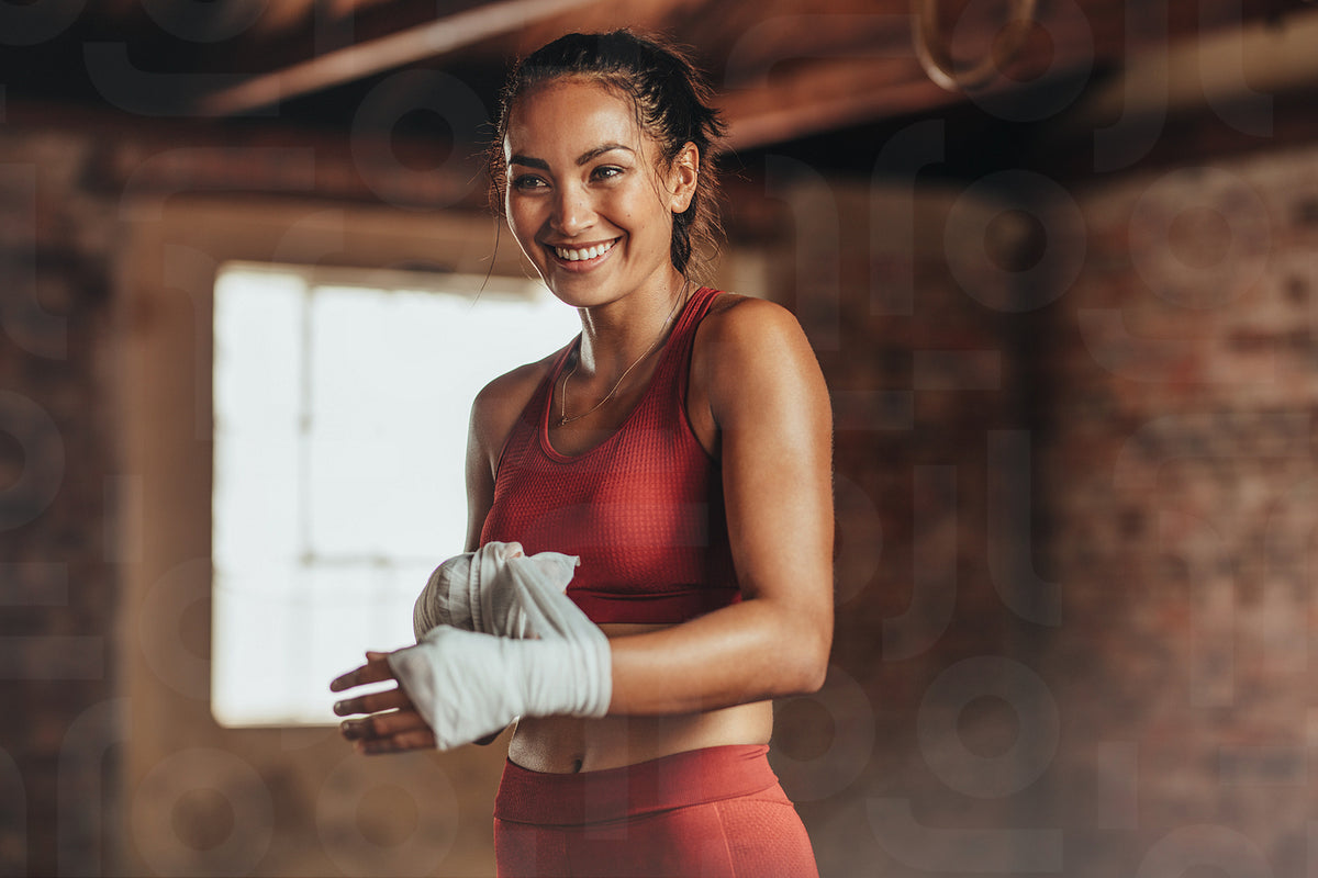 Woman getting ready for boxing practice – Jacob Lund Photography Store ...