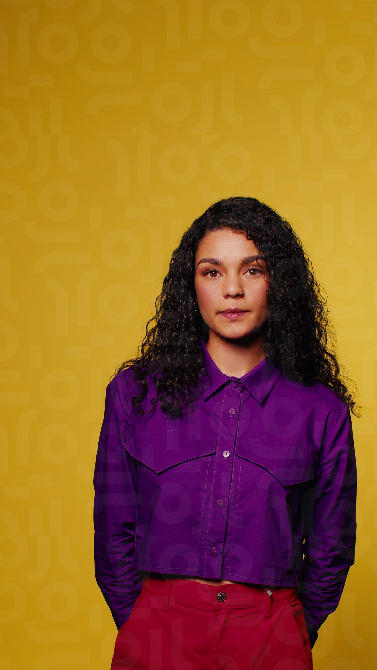 Confident young woman poses in vibrant studio portrait – Jacob Lund ...