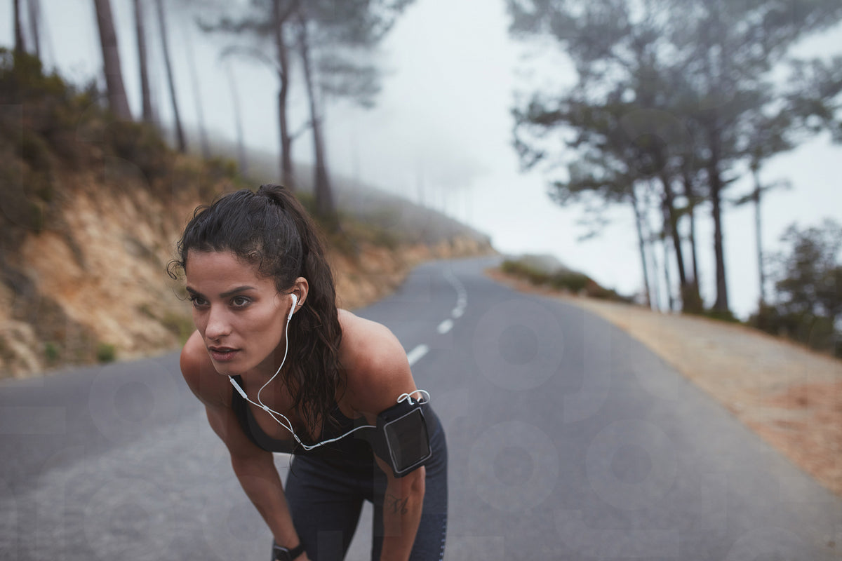 Female runner taking a break from workout – Jacob Lund Photography ...