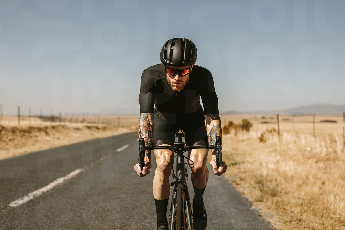 Cyclist in black – Jacob Lund Photography Store- premium stock photo