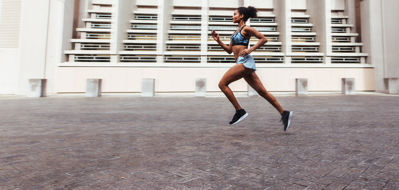 Woman running outdoors – Jacob Lund Photography Store- premium stock photo