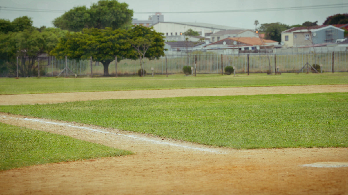 Baseball player slides into base during game – Jacob Lund Photography ...