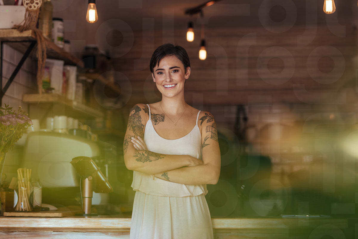 Woman entrepreneur standing at the counter of her cafe – Jacob Lund ...
