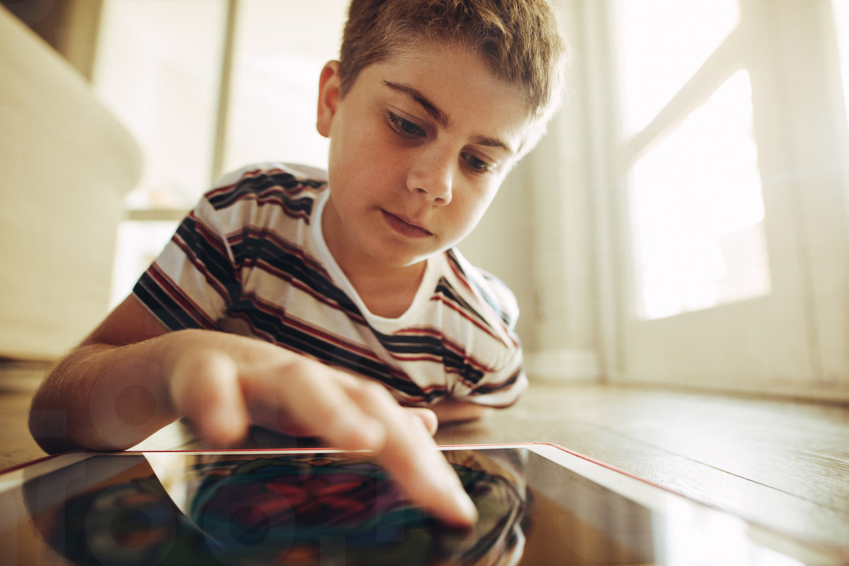 Tech savvy kid using tablet pc – Jacob Lund Photography Store- premium ...
