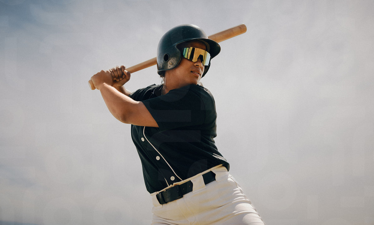 Confident baseball player prepared to swing as batter at home plate du ...