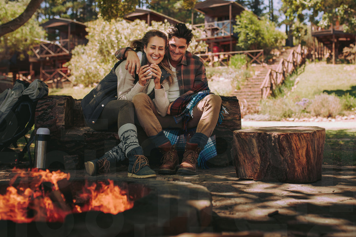 Loving couple resting by a bonfire at campsite – Jacob Lund Photography ...