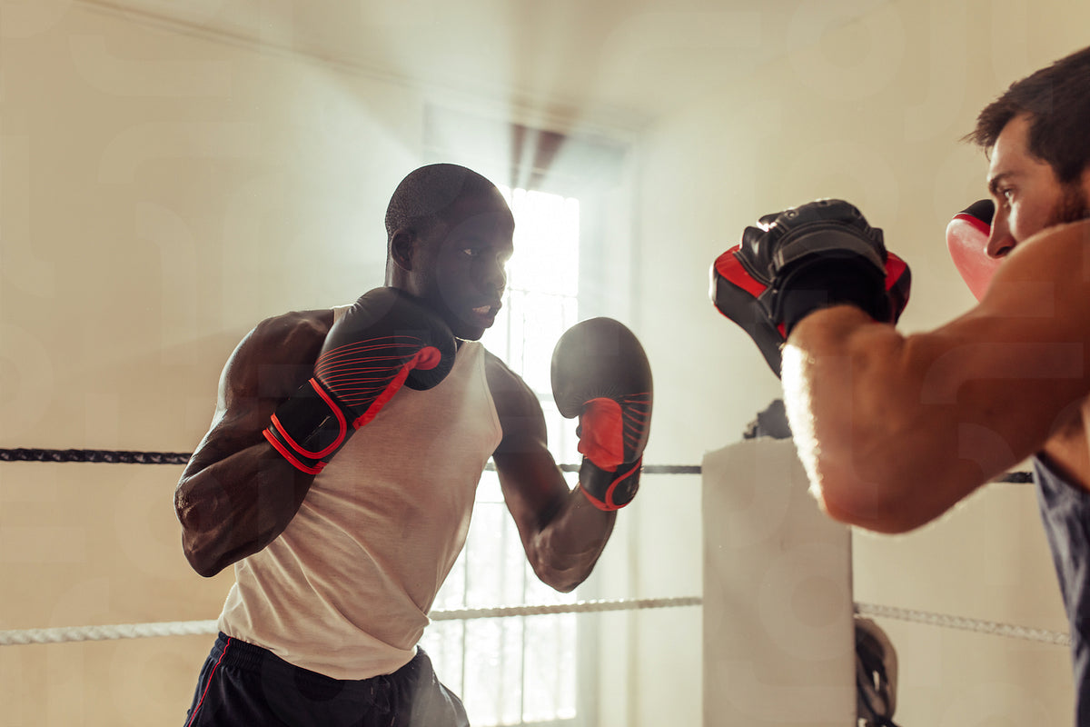 Fighter training with a sparring partner in a boxing ring – Jacob Lund ...