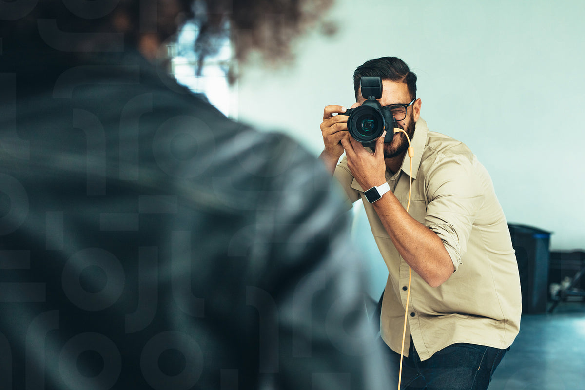 Photographer doing a photo shoot in a studio – Jacob Lund Photography ...