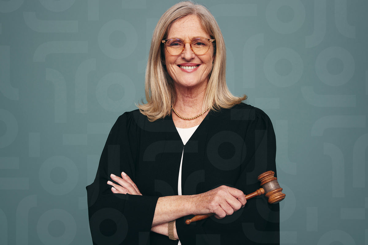 Successful female judge smiling at the camera in a studio – Jacob Lund ...