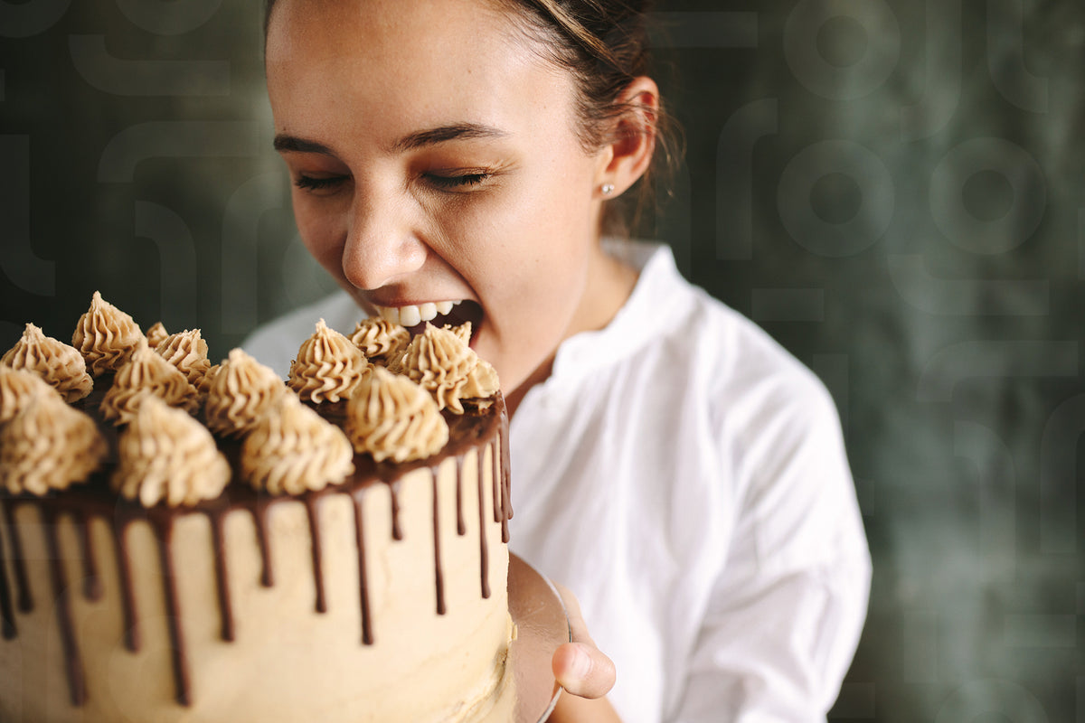 Female confectioner eating whole cake – Jacob Lund Photography Store ...