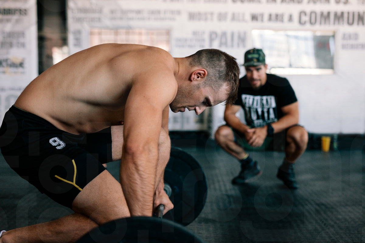 Muscular man lifting a barbell at crossfit gym – Jacob Lund Photography ...