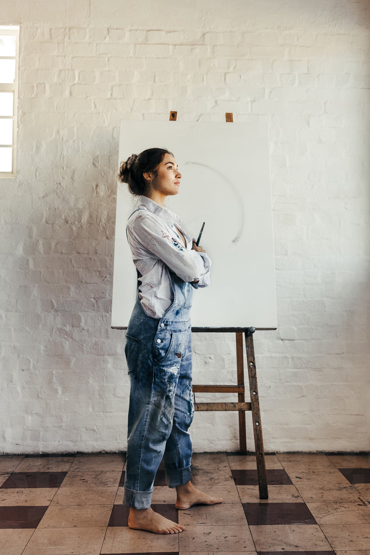 Female artist thinking of new creative ideas in her studio – Jacob Lund ...
