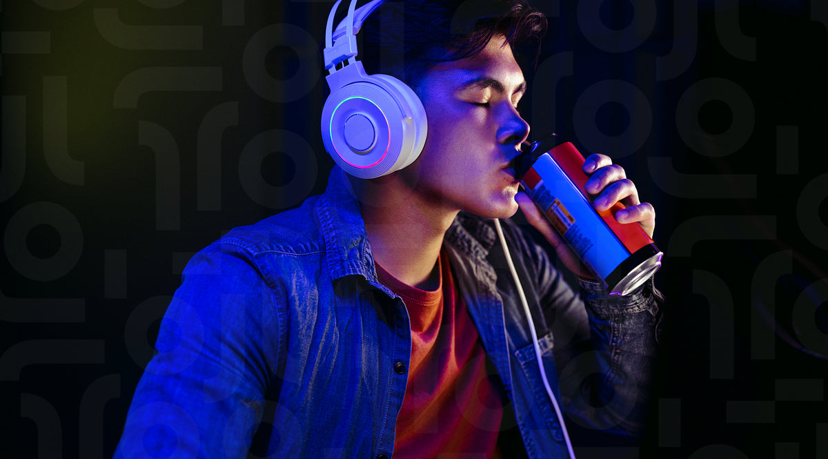 Computer gamer drinking an energy drink and taking a break from gaming ...