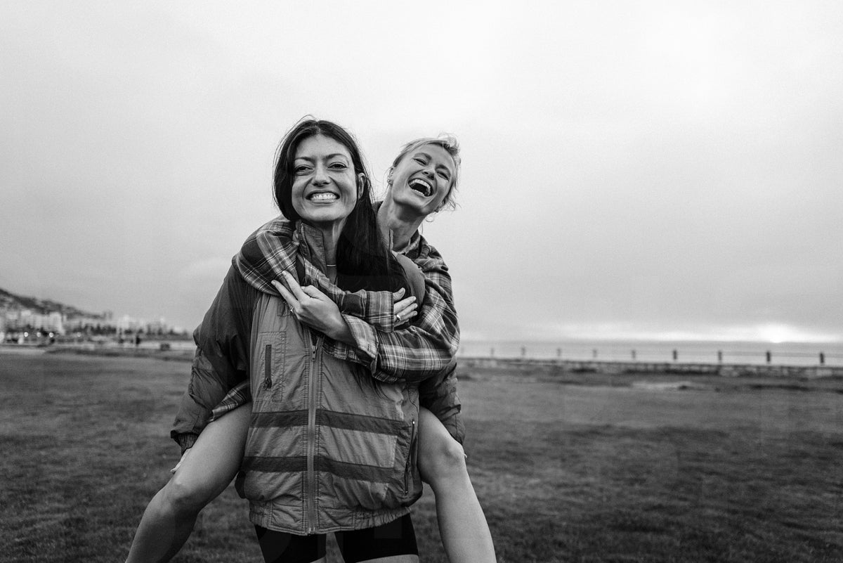 Best friends enjoying a piggyback ride with smiles – Jacob Lund ...