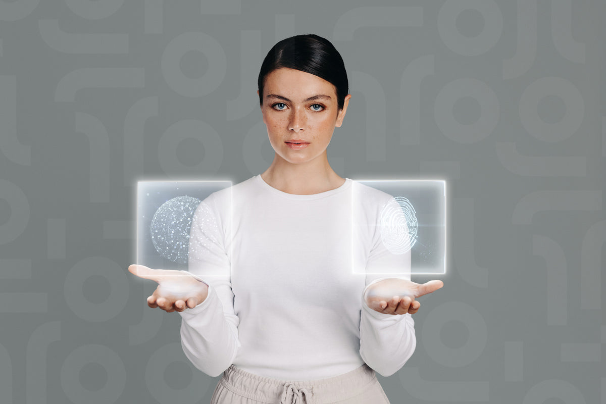 Portrait of a tech-savvy woman holding two graphic icons in a studio ...