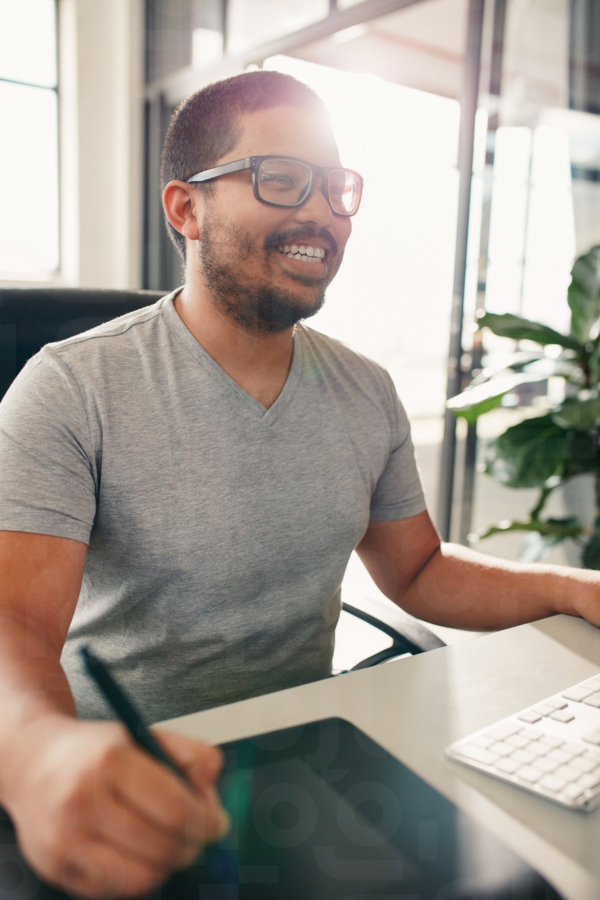 Happy graphic designer working in his office – Jacob Lund Photography ...