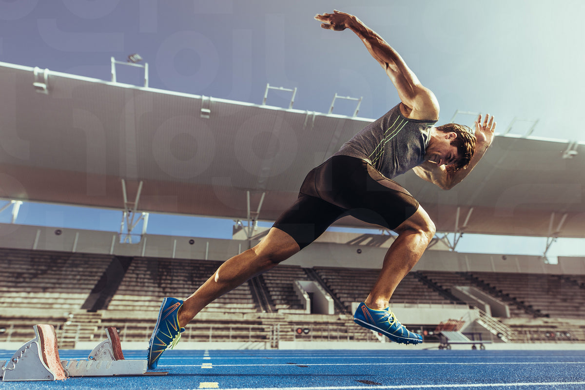 Sprinter taking off from starting block on running track – Jacob Lund ...
