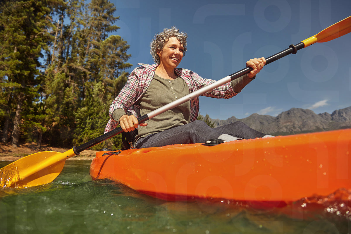 Senior woman canoeing on summer day – Jacob Lund Photography Store ...