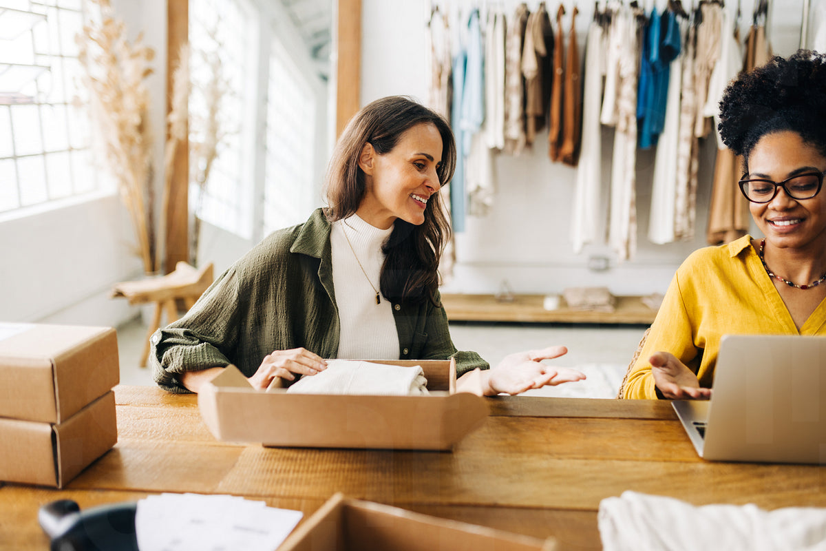 Female dropshippers at work: Business women running an online store ...