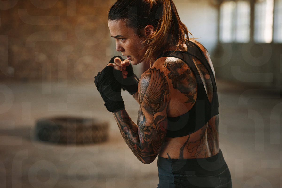 Female doing shadow boxing in empty factory shade – Jacob Lund ...
