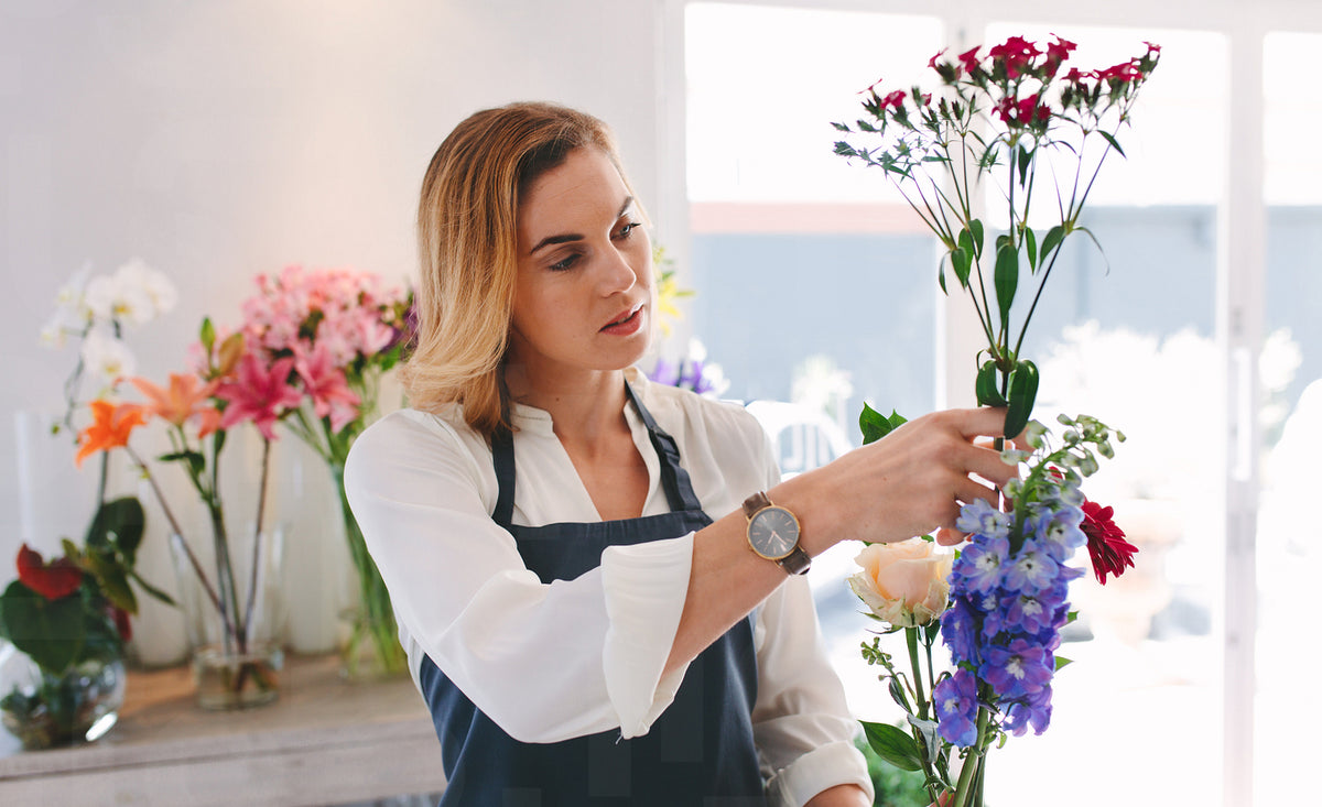 Female working at flower shop arranging flowers – Jacob Lund ...