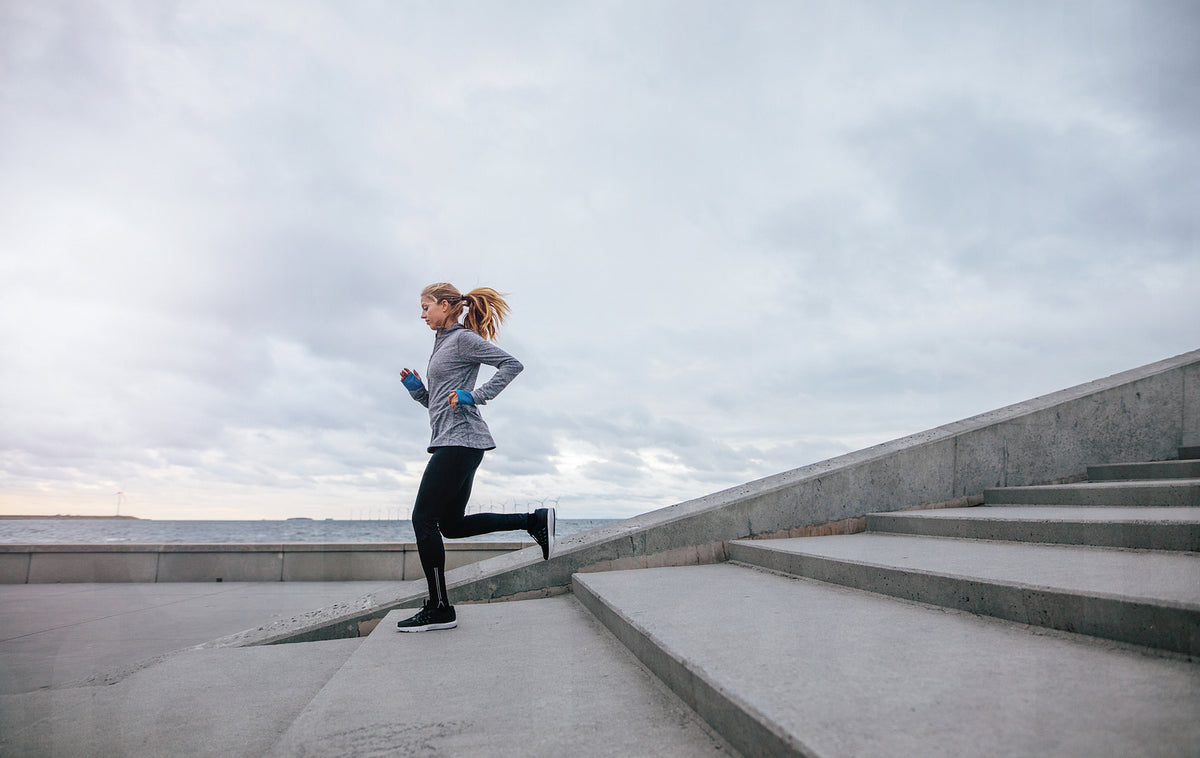 Healthy young woman running down the steps – Jacob Lund Photography ...