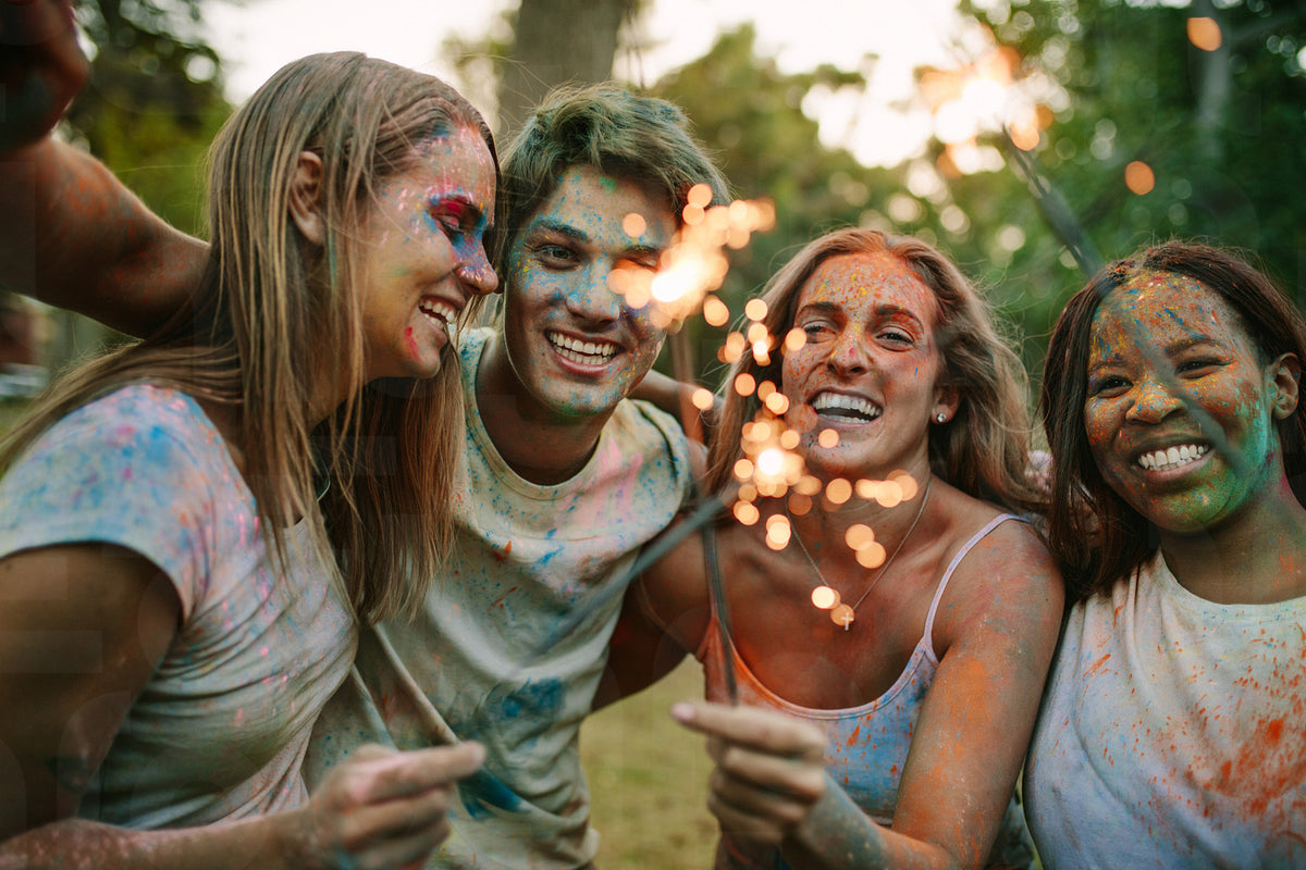 Group of friends burning fire sparkles while playing holi – Jacob Lund ...