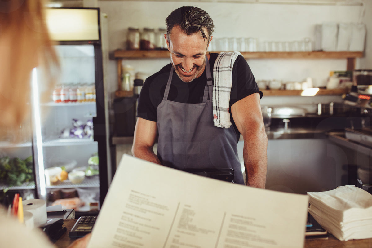 Cafe owner taking order from customer – Jacob Lund Photography Store ...